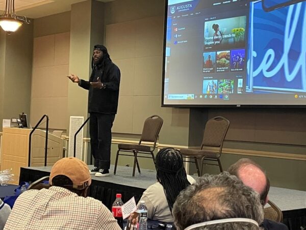 Author Jason Reynolds speaks to teachers about writing at Augusta ...