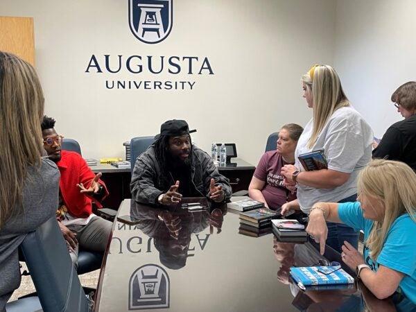 Author Jason Reynolds speaks to teachers about writing at Augusta ...